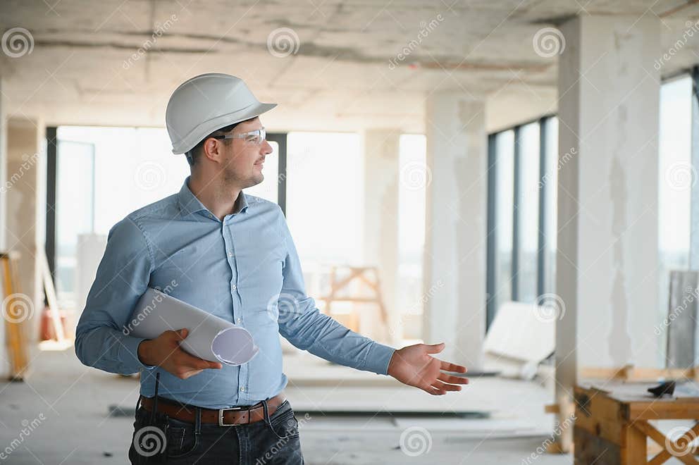 Portrait of an Architect Builder Studying Layout Plan of the Rooms ...