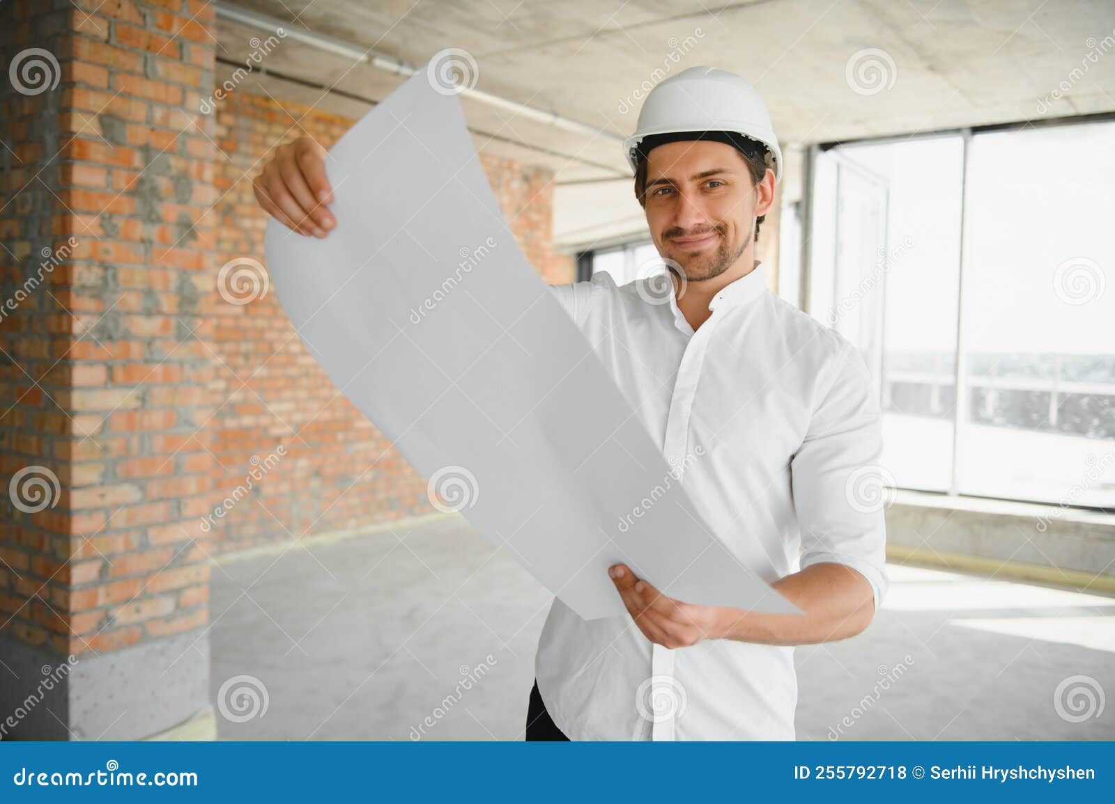 Portrait of an Architect Builder Studying Layout Plan of the Rooms ...