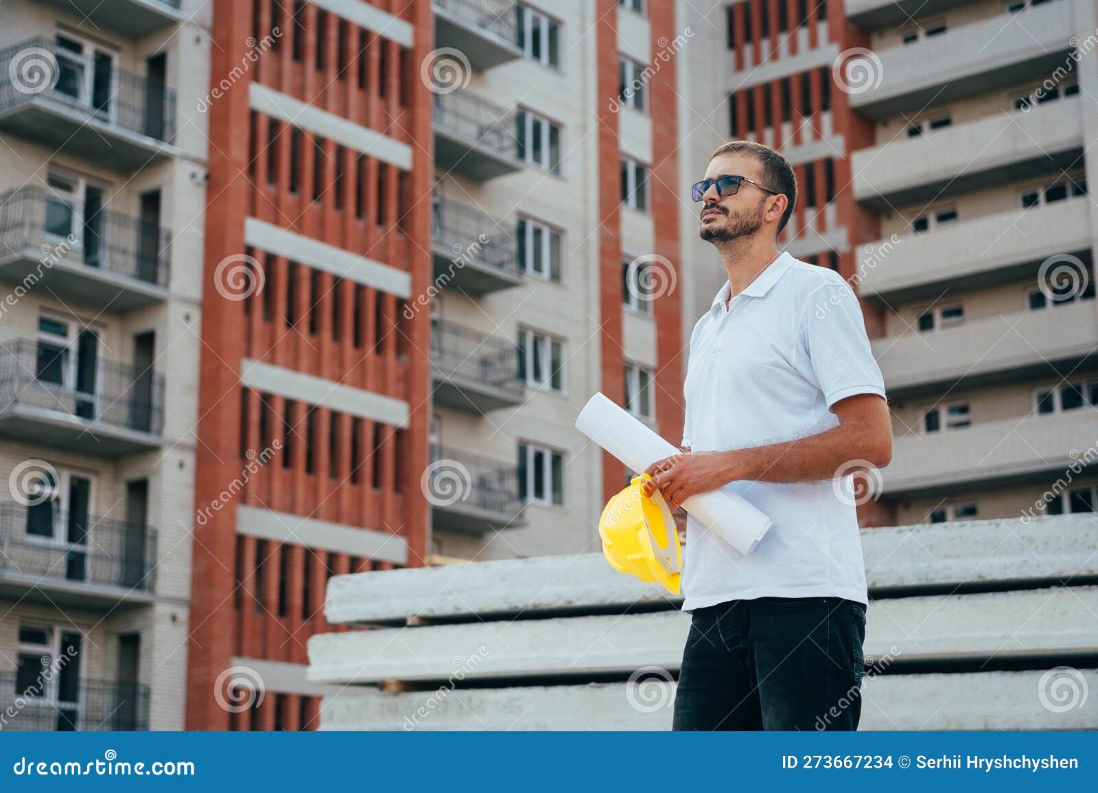 Portrait of an Architect Builder Studying Layout Plan of the Rooms ...