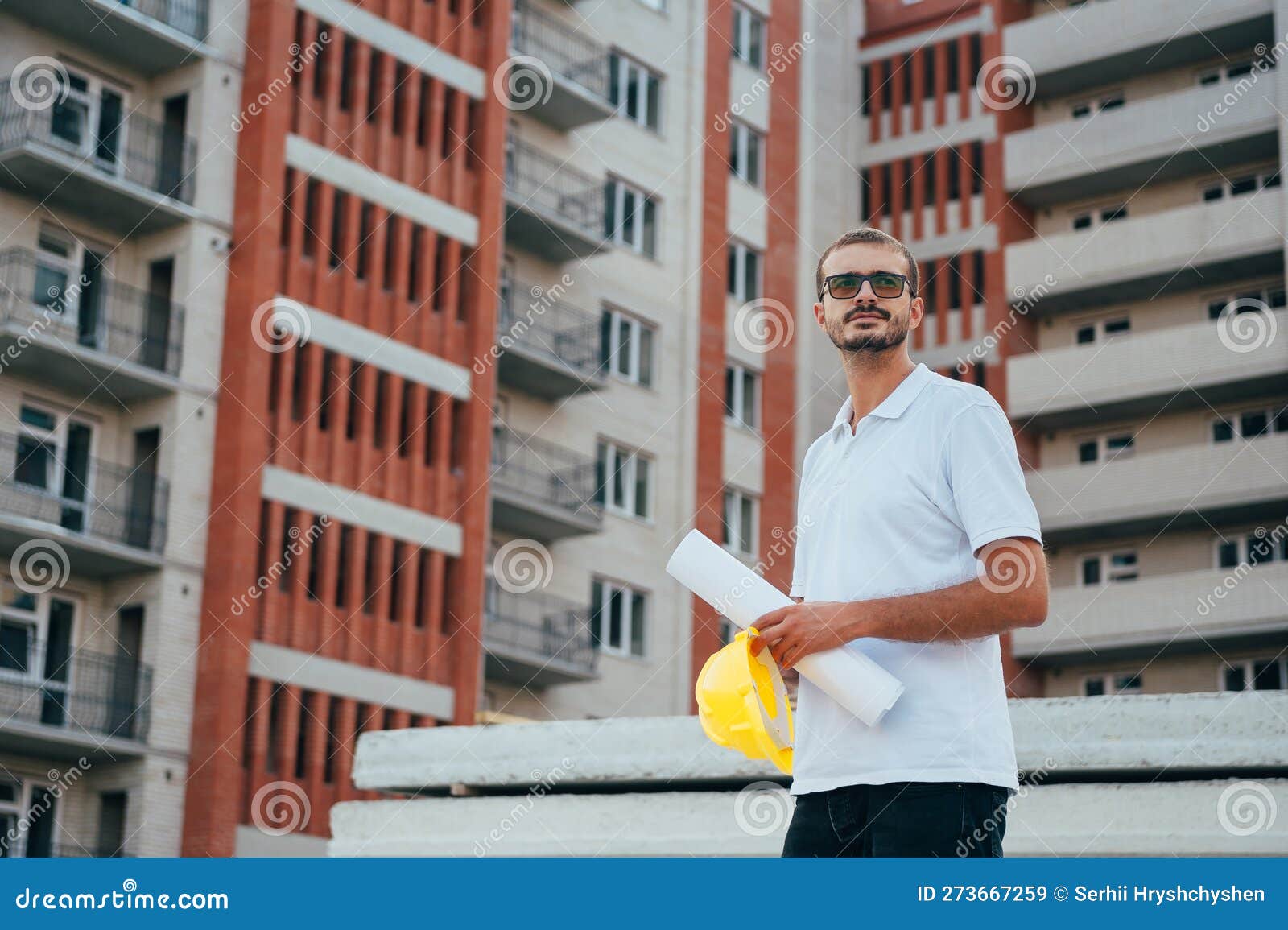 Portrait of an Architect Builder Studying Layout Plan of the Rooms ...