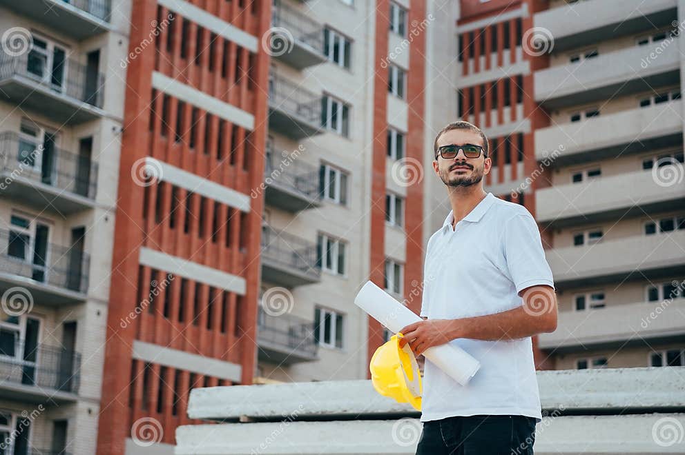 Portrait of an Architect Builder Studying Layout Plan of the Rooms ...