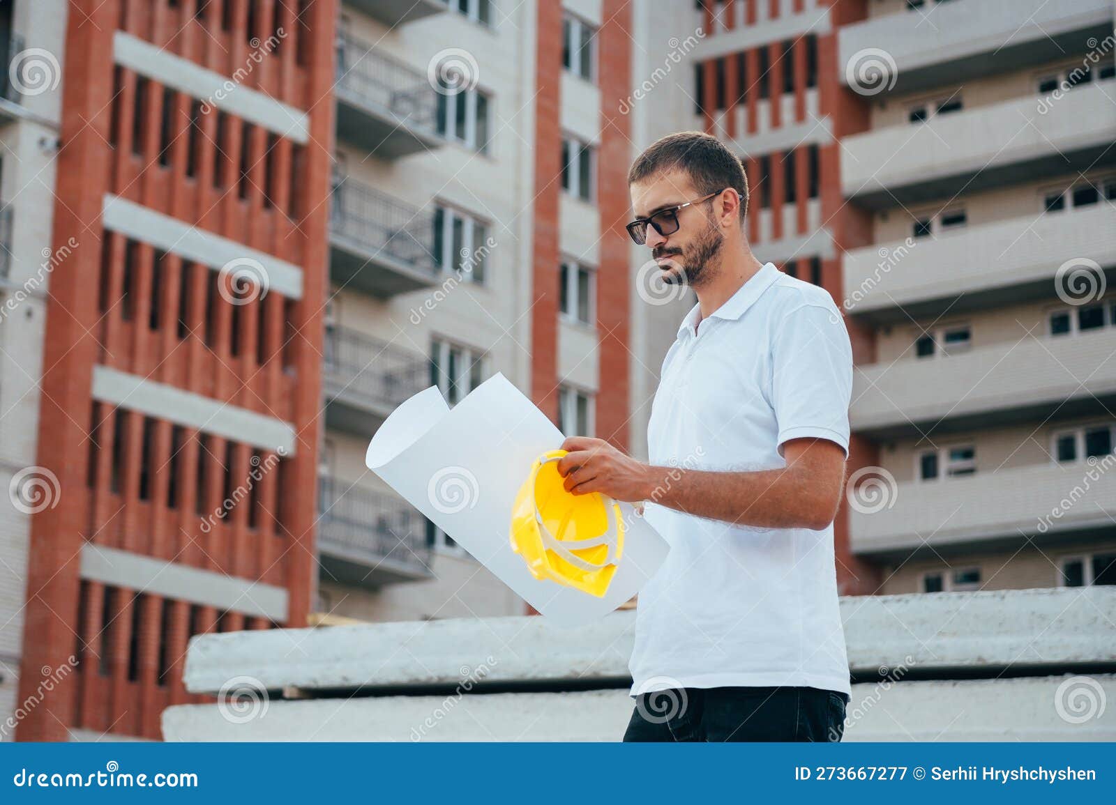 Portrait of an Architect Builder Studying Layout Plan of the Rooms ...