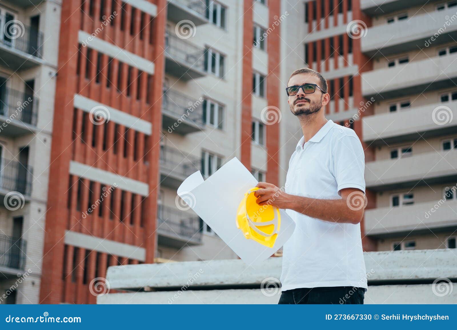 Portrait of an Architect Builder Studying Layout Plan of the Rooms ...