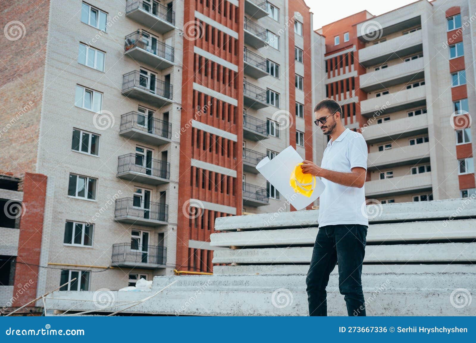 Portrait of an Architect Builder Studying Layout Plan of the Rooms ...