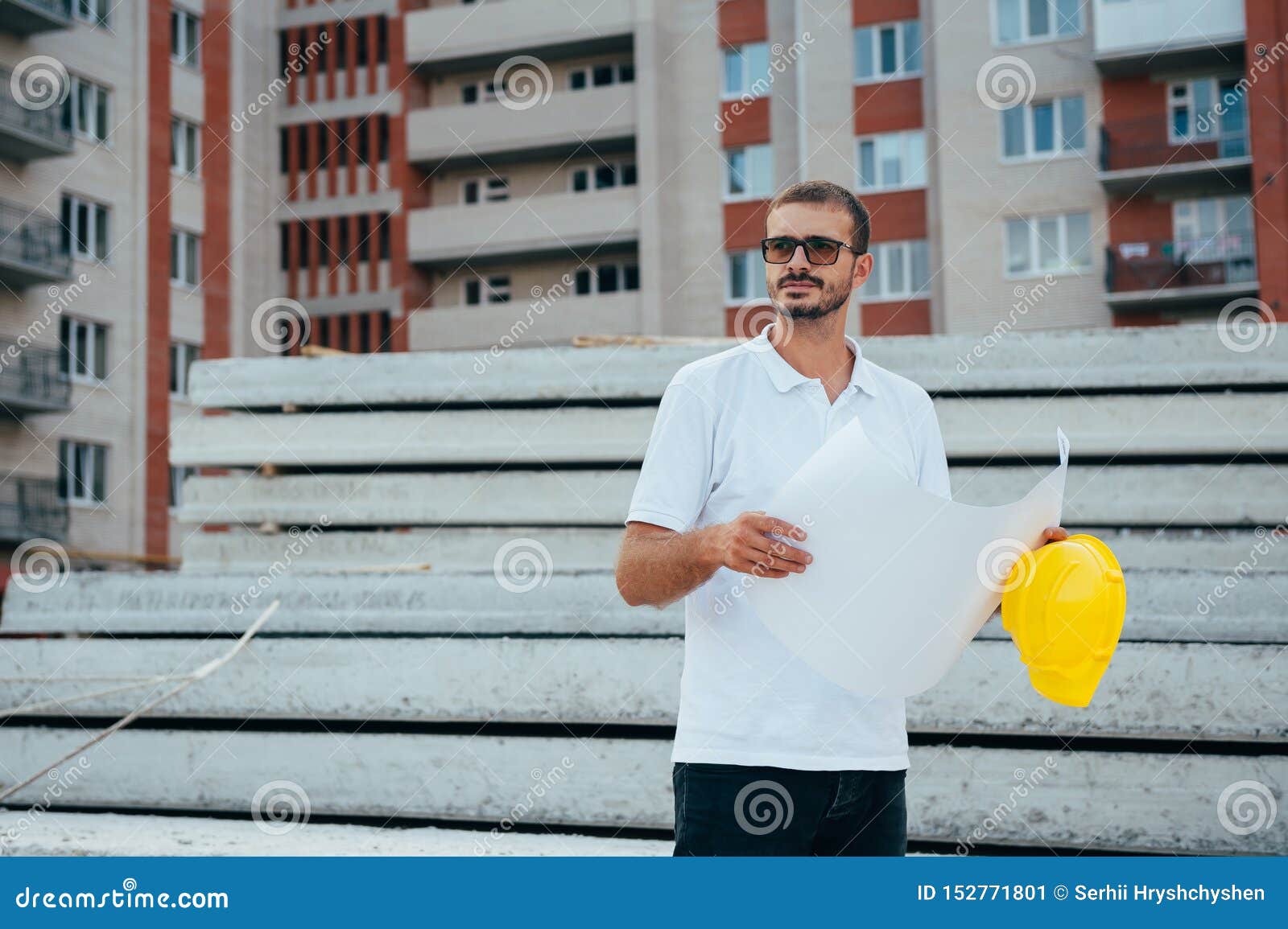 Portrait of an Architect Builder Studying Layout Plan of the Rooms ...
