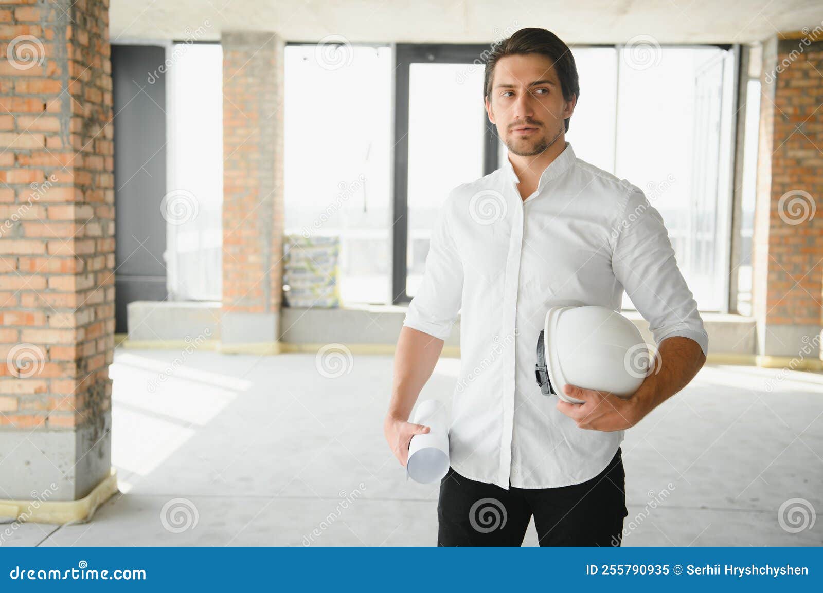 Portrait of an Architect Builder Studying Layout Plan of the Rooms ...