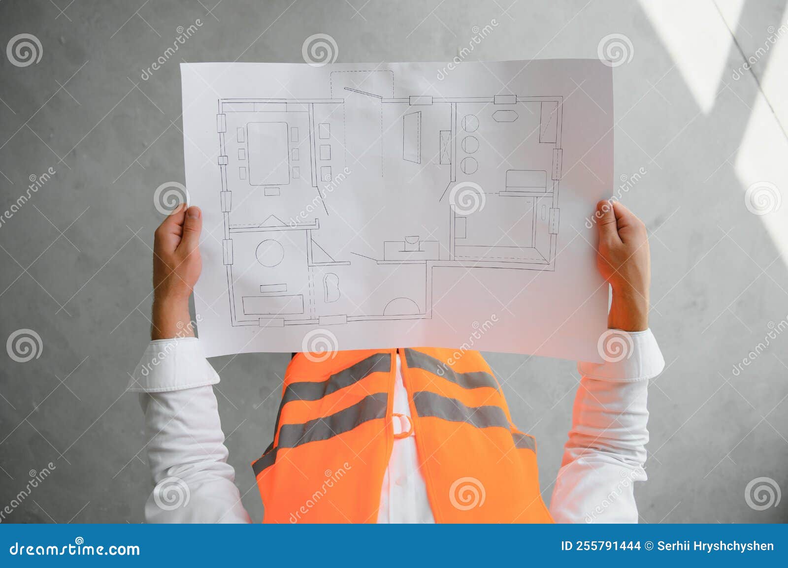 Portrait of an Architect Builder Studying Layout Plan of the Rooms ...