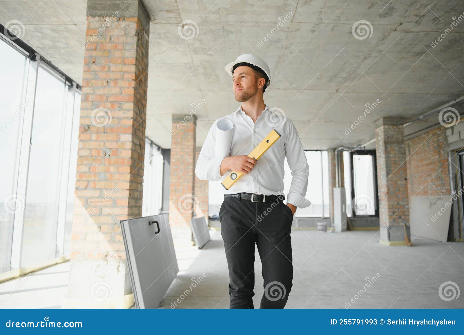 Portrait of an Architect Builder Studying Layout Plan of the Rooms ...