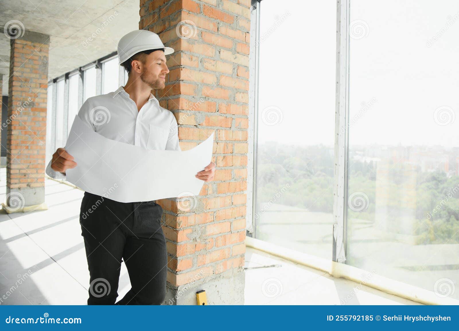 Portrait of an Architect Builder Studying Layout Plan of the Rooms ...