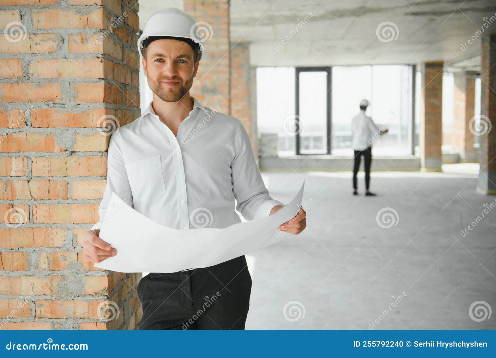 Portrait of an Architect Builder Studying Layout Plan of the Rooms ...