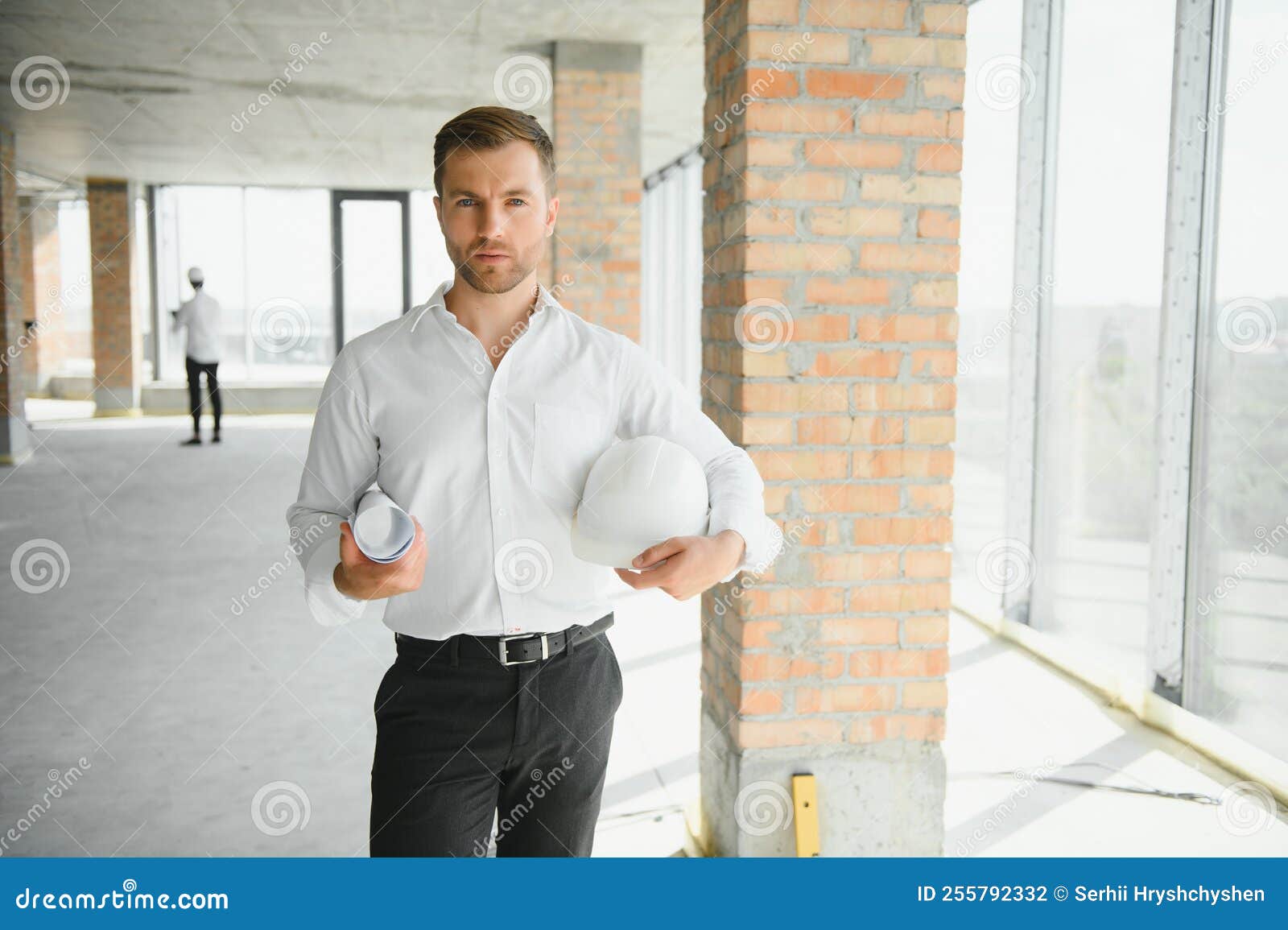Portrait of an Architect Builder Studying Layout Plan of the Rooms ...