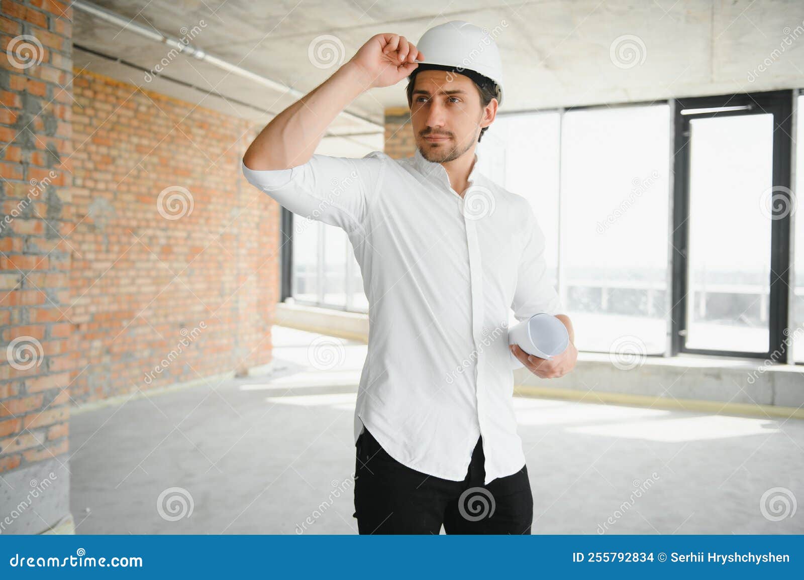 Portrait of an Architect Builder Studying Layout Plan of the Rooms ...