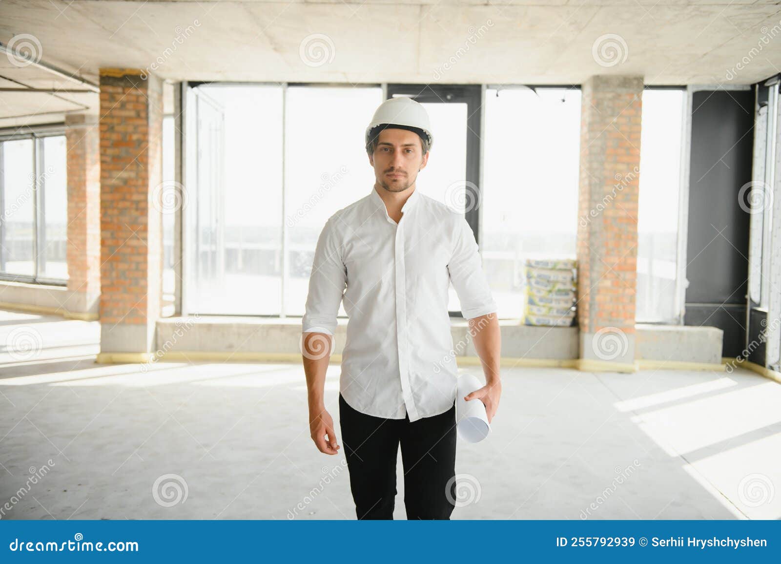Portrait of an Architect Builder Studying Layout Plan of the Rooms ...