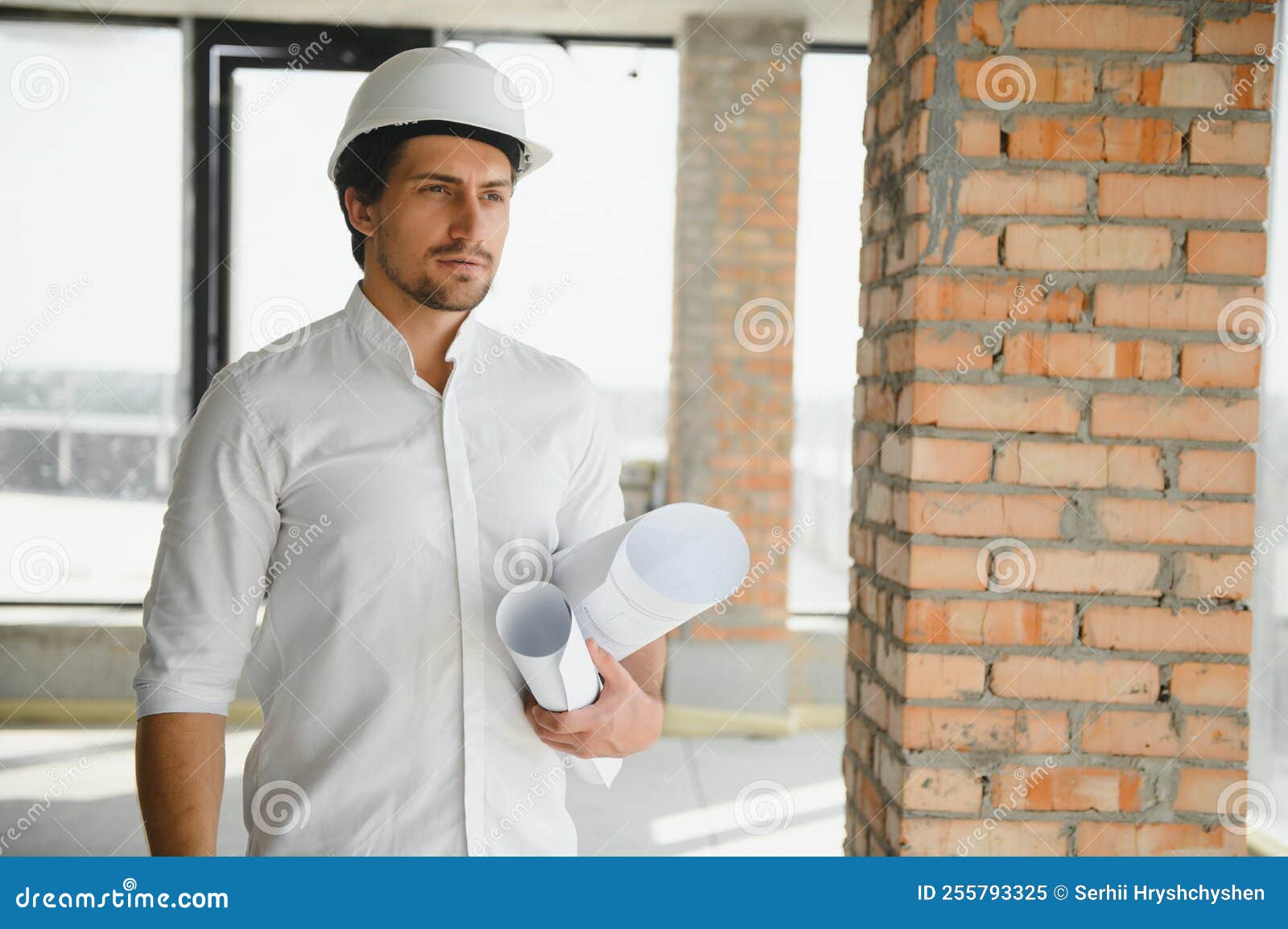 Portrait of an Architect Builder Studying Layout Plan of the Rooms ...