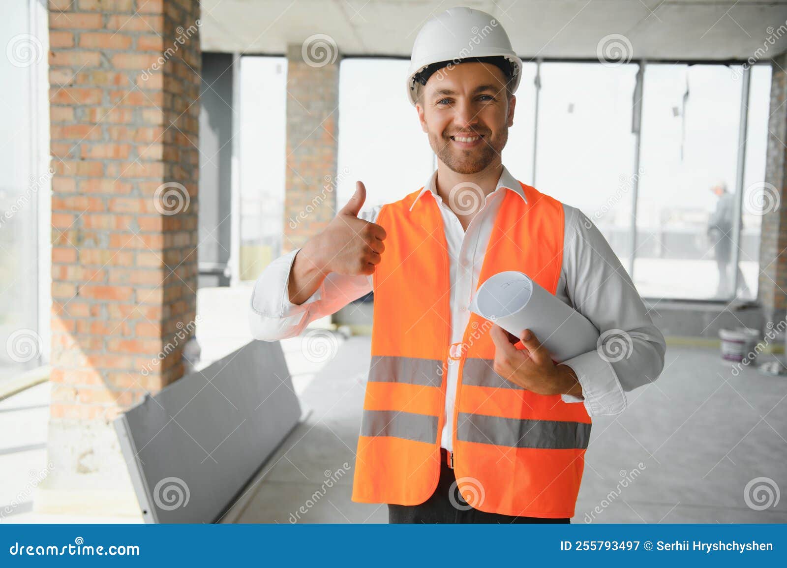 Portrait of an Architect Builder Studying Layout Plan of the Rooms ...