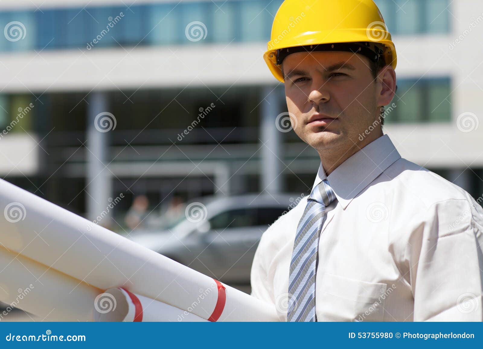 Portrait of Architect in Hardhat Holding Blueprint at Construction Site ... Portrait of Architect in Hardhat Holding Blueprint at Construction Site ...