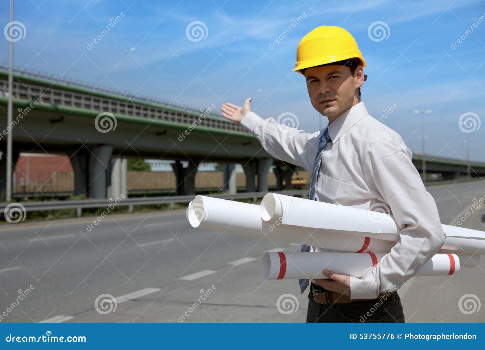 Portrait of Architect in Hardhat Holding Blueprint and Gesturing Stock ... Portrait of Architect in Hardhat Holding Blueprint and Gesturing Stock ...