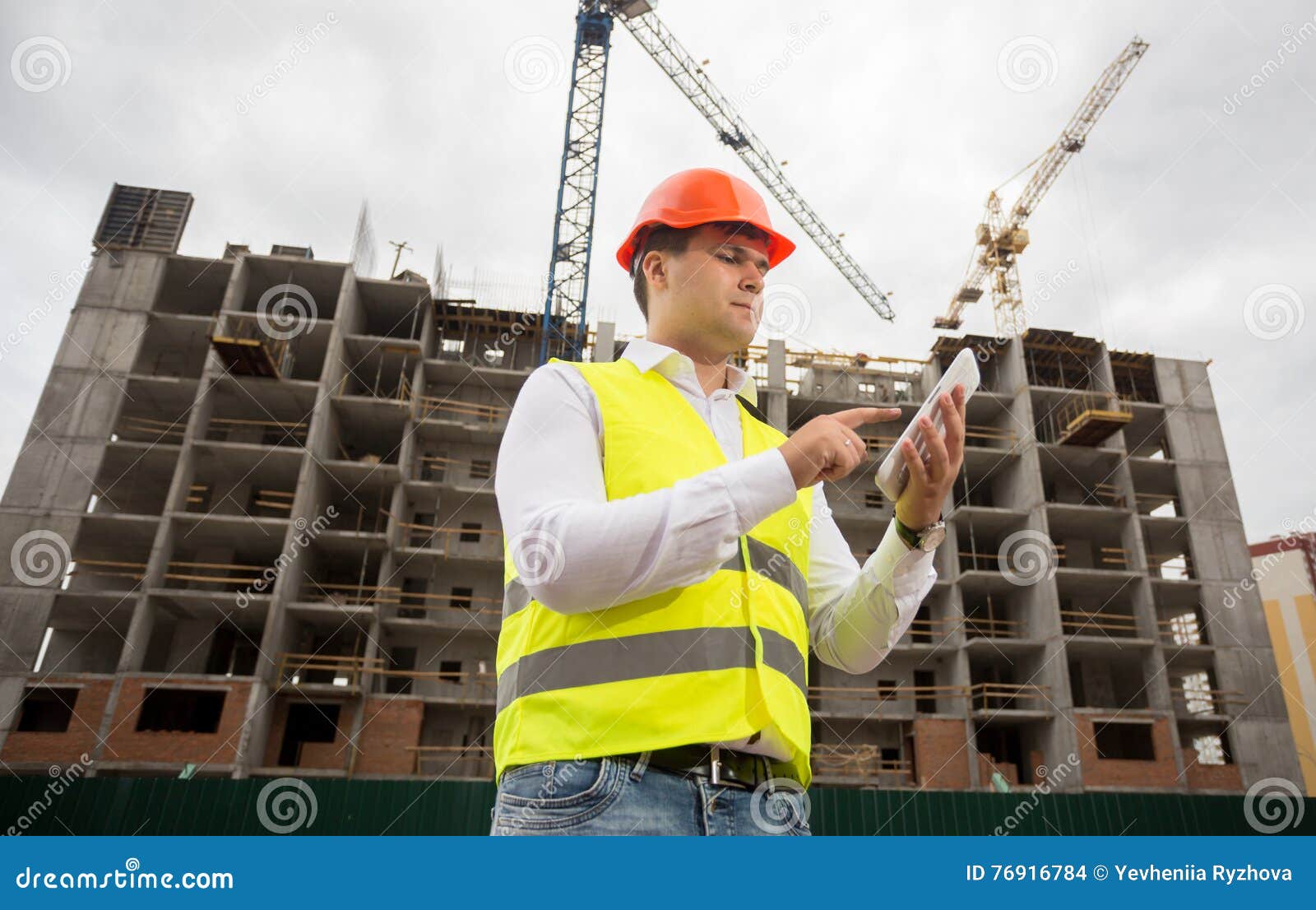 Portrait of Architect in Hardhat and Safety Vest Using Digital T Stock ...