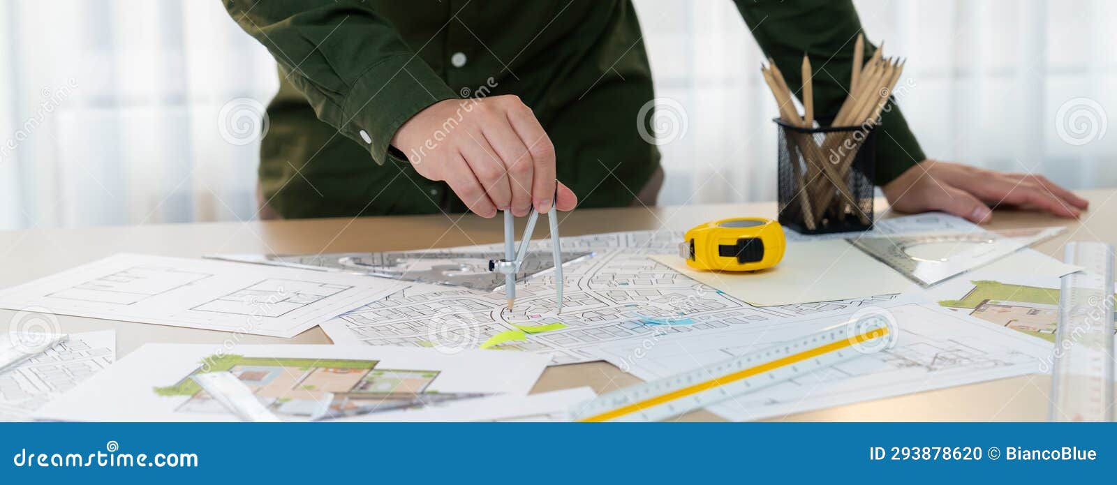 Architect Using Divider To Measure Blueprint. Focus on Hand ...