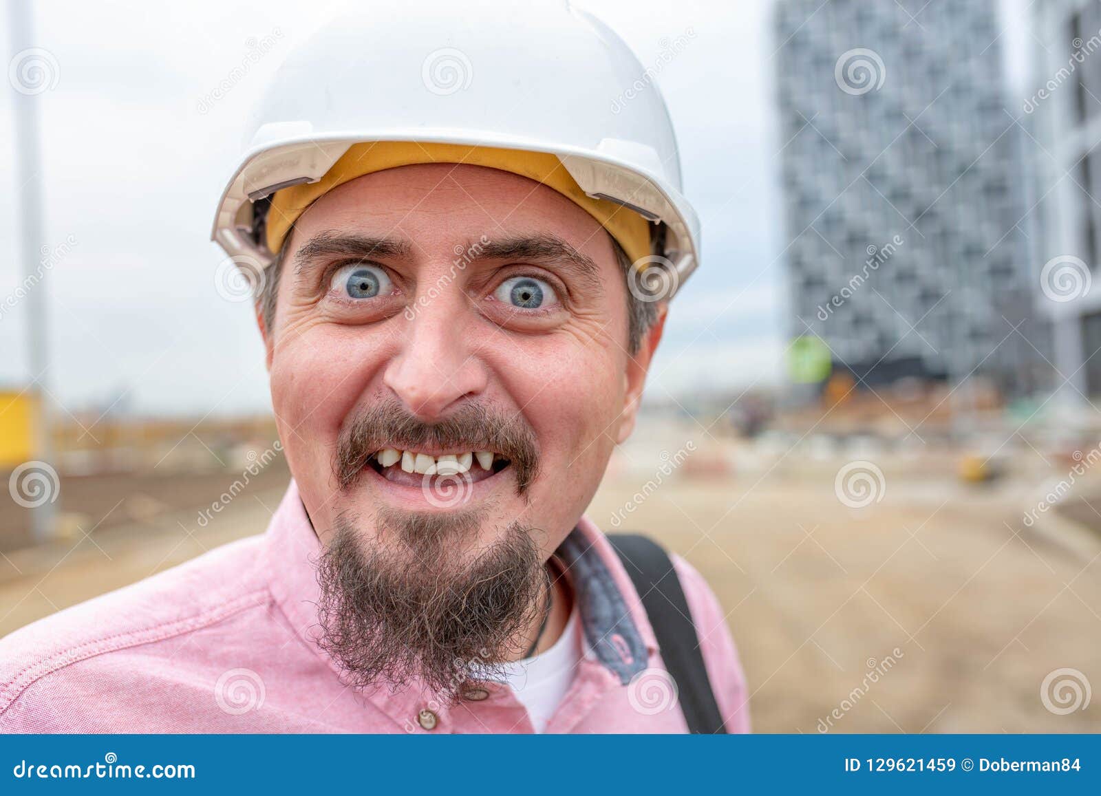 Portrait of Architect at Work with Helmet with Crazy Fa E in a ...