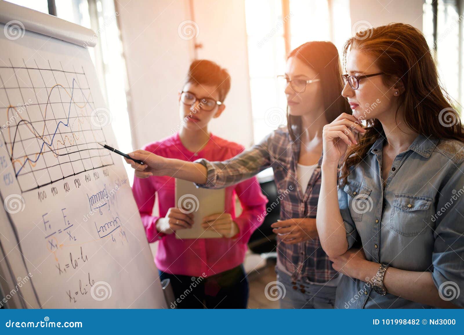 Portrait of Architects Discussing and Drawing on Board Stock Photo ...