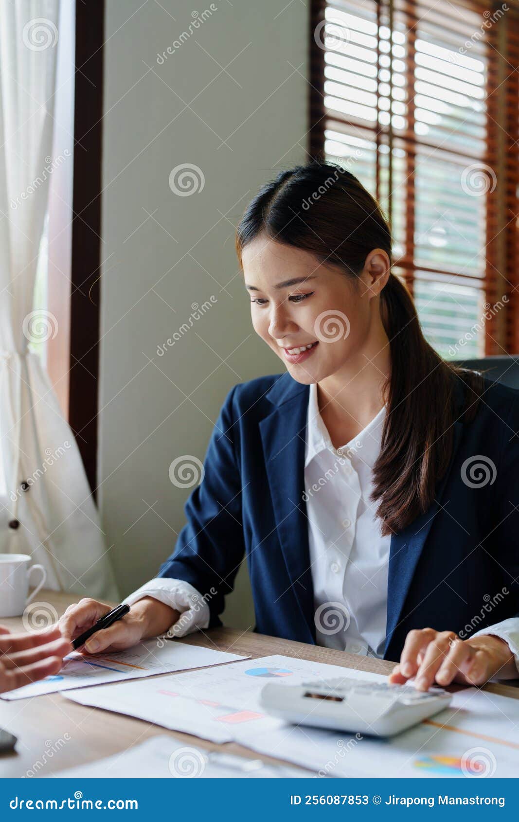 Portrait of an Asian Accountant Checking Accounts for Customers Stock ...
