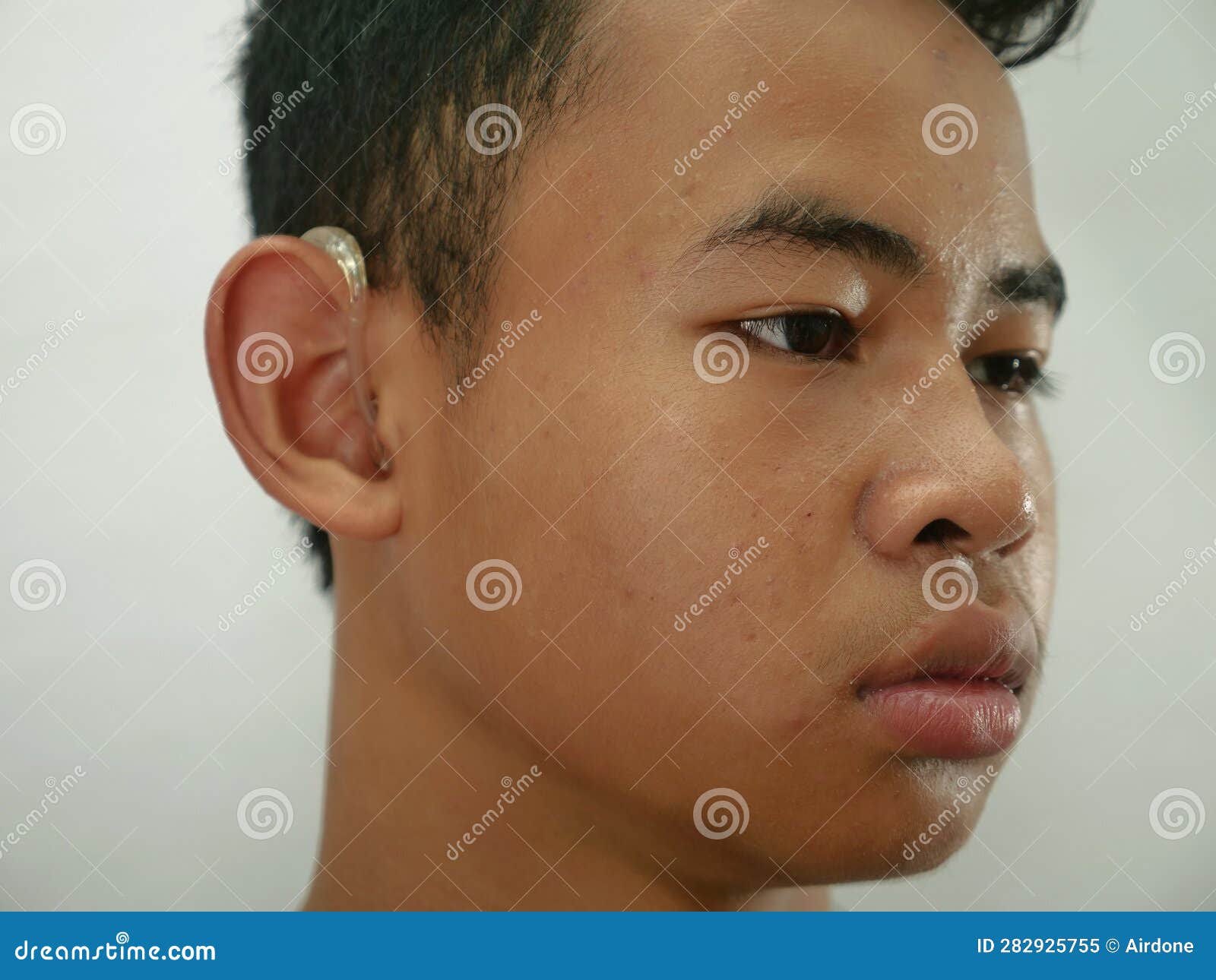 Portrait of Asian Boy Wearing Hearing Aid Device Stock Image - Image of ...