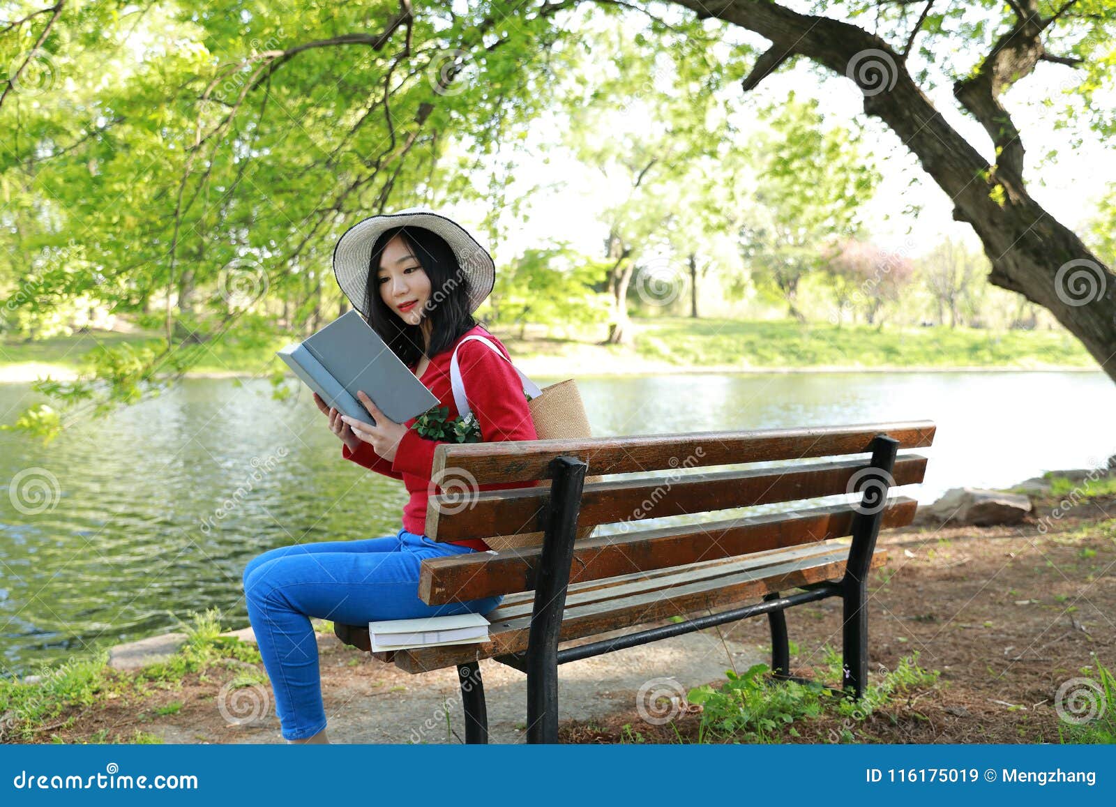 Portrait Of A Asian Chinese Free Woman Reading Book In Spring Autumn