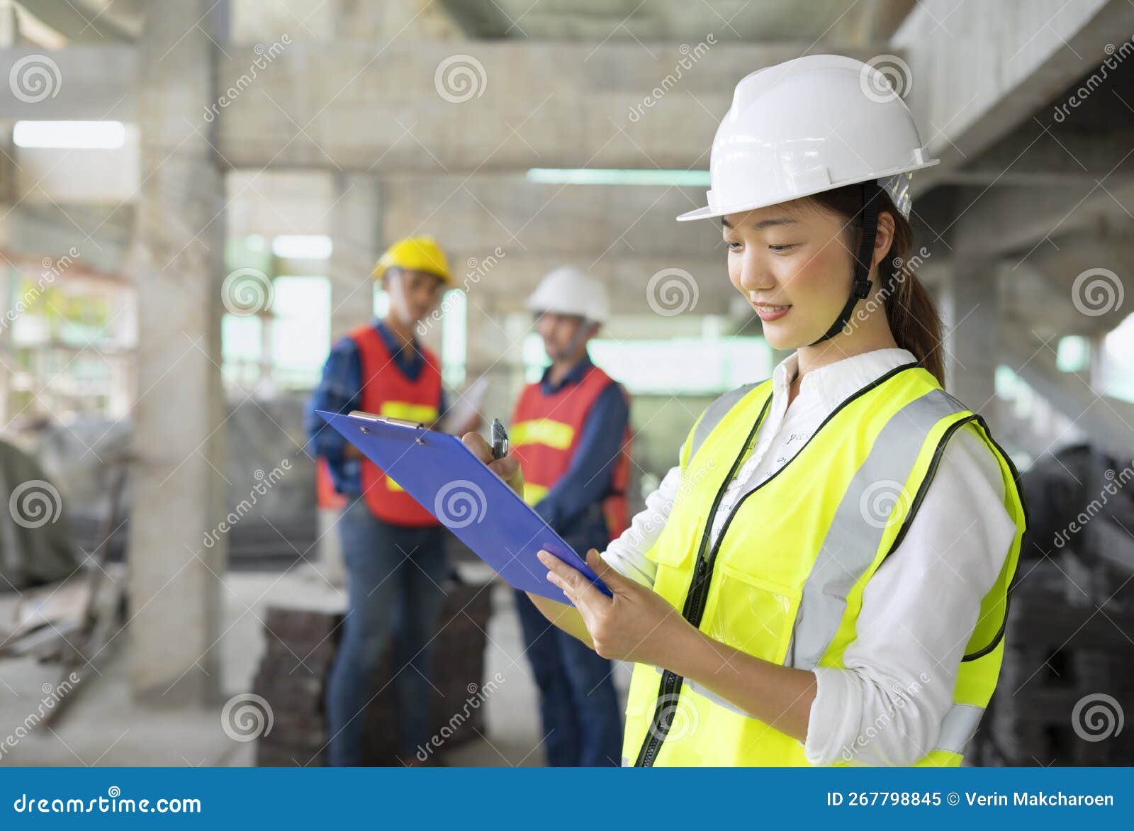 Portrait an Asian Female Engineer Checking the Accuracy of Building ...