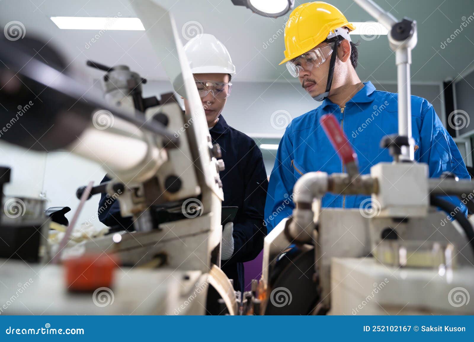 Portrait of Asian Maintenance Engineer Workers Working Machines in the ...