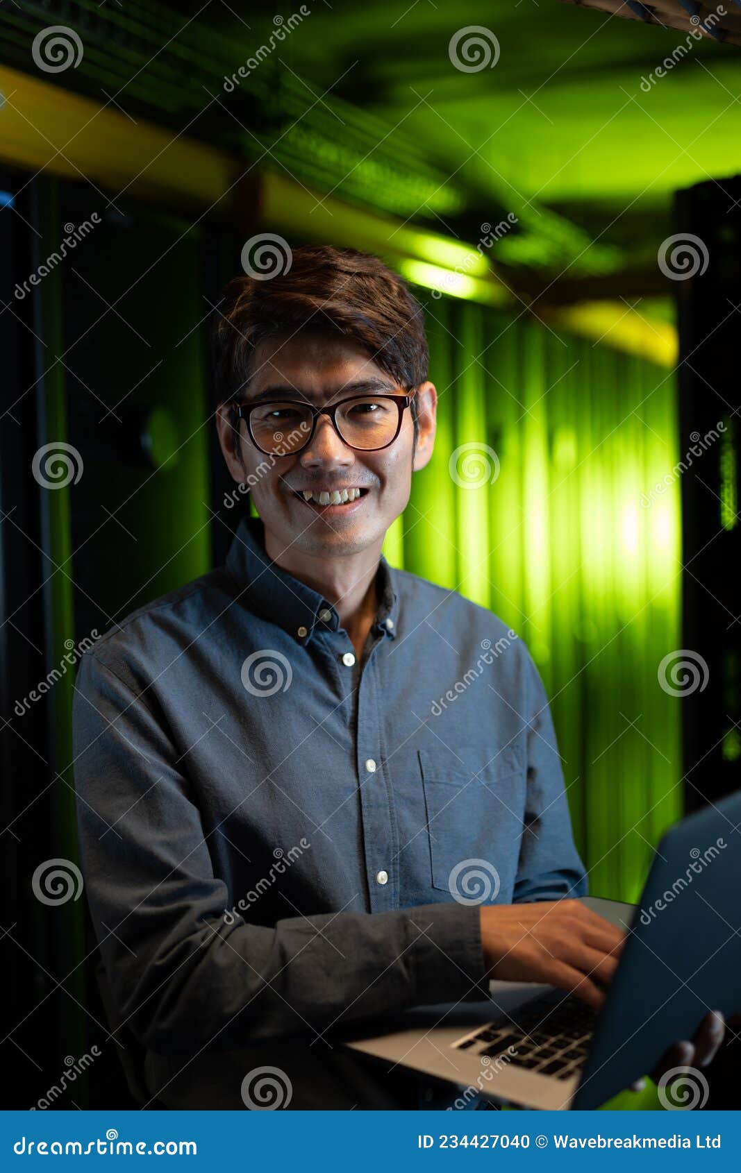 Portrait of Asian Male Engineer Smiling while Using Laptop in Computer ...
