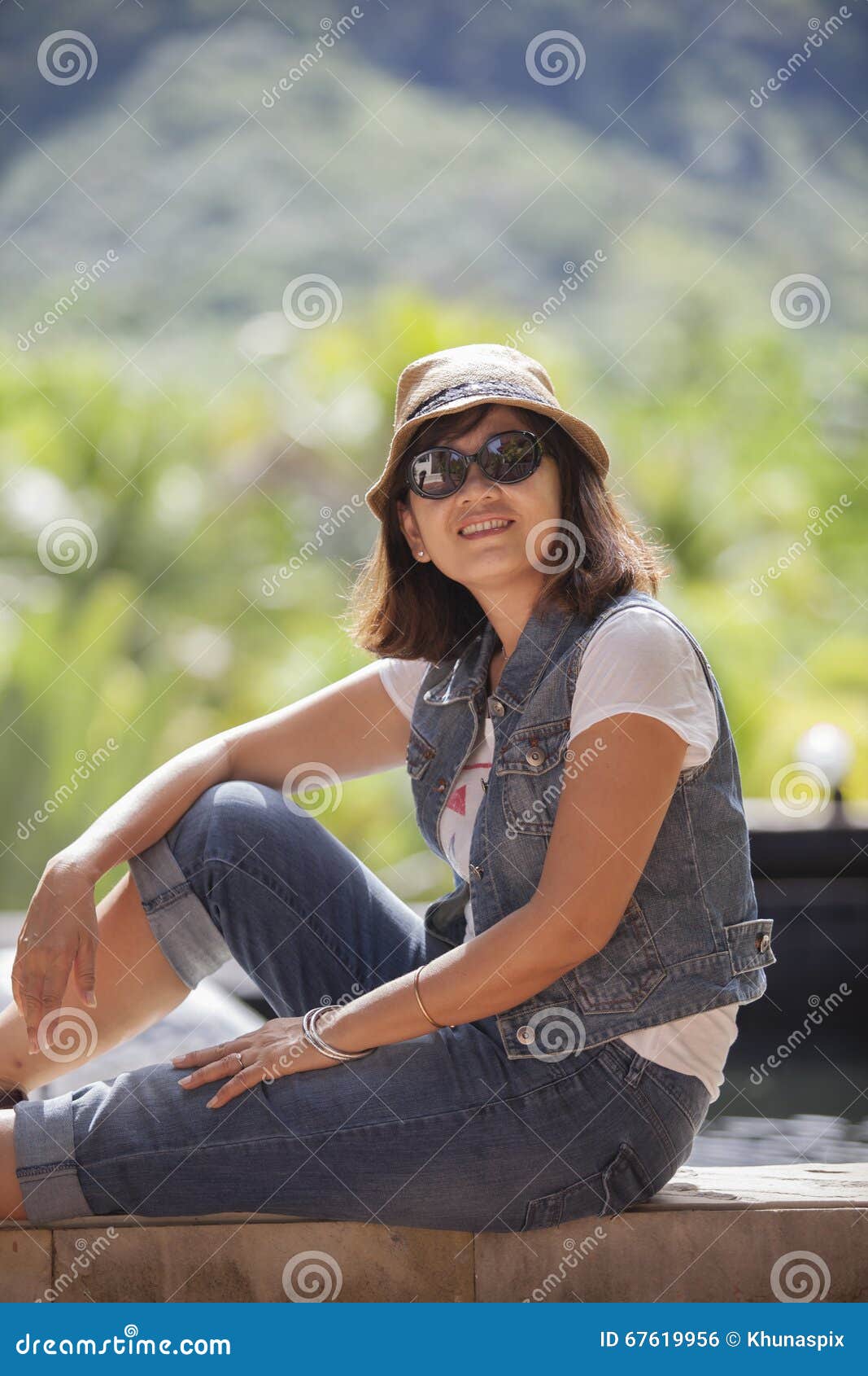 Portrait Of Asian 40s Years Woman Wearing Straw Hat And Sun Glasses
