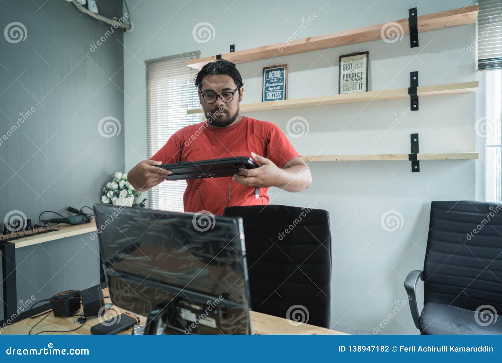 Portrait of Asian Young Man Fix a Problem with Keyboard of Personal ... Portrait of Asian Young Man Fix a Problem with Keyboard of Personal ...