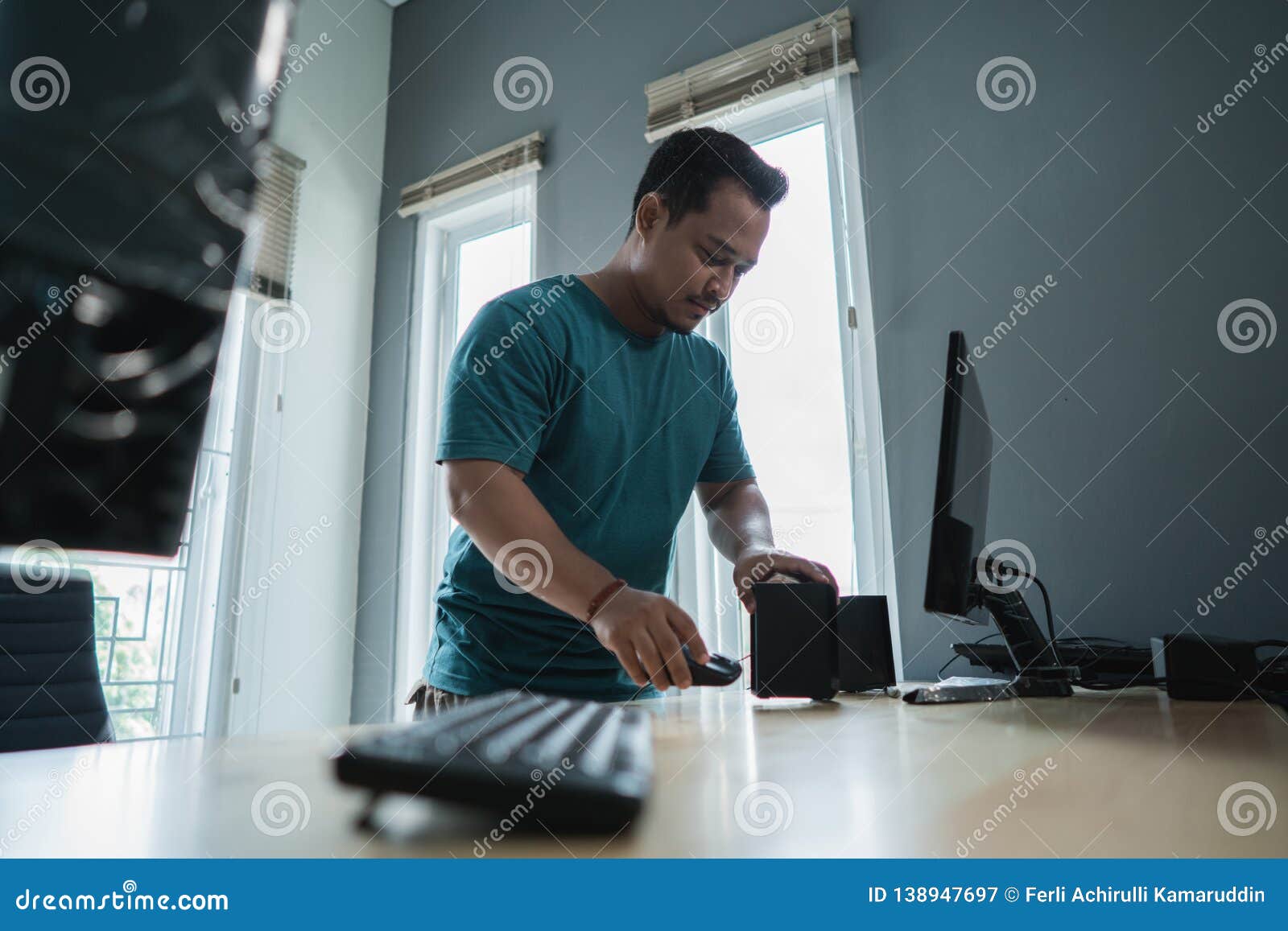 Portrait of Asian Young Man Fix a Problem of Personal Computer Stock ...