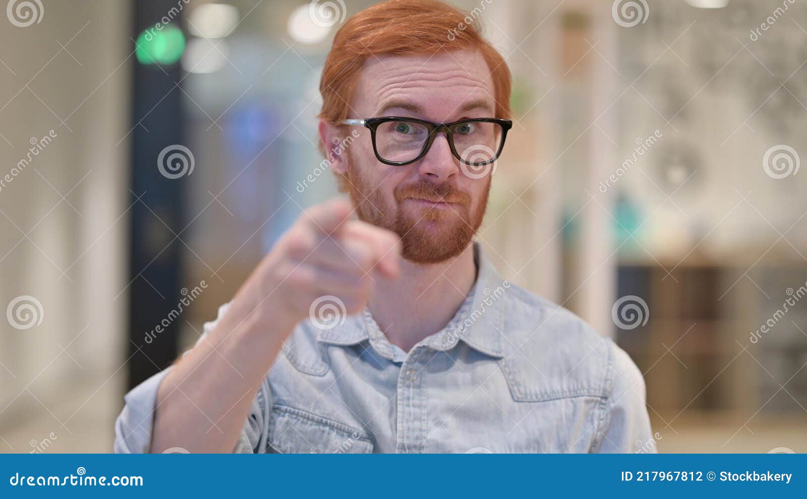 Young Redhead Man Pointing with Finger Stock Photo - Image of working ...