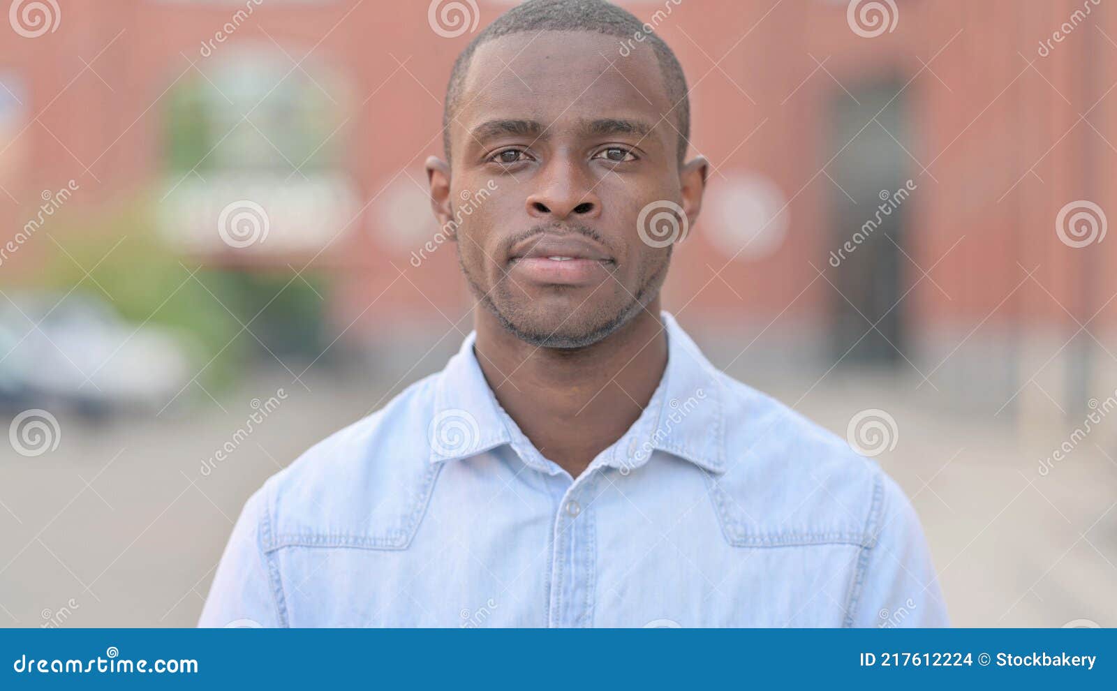 Portrait of Attractive African Man Looking at Camera Stock Photo ...