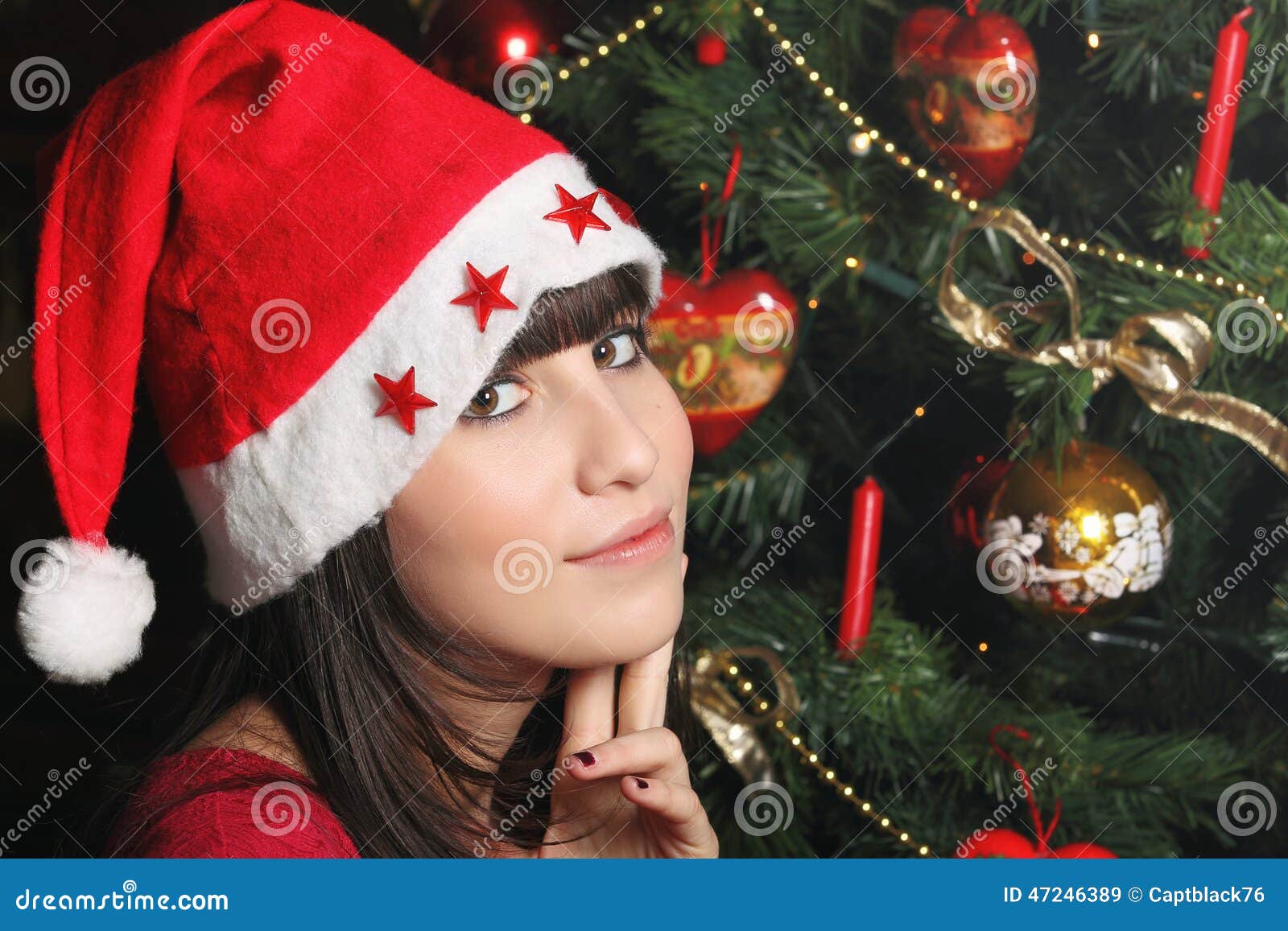 Portrait Of An Attractive Brunette Girl With Christmas Hat Stock Image