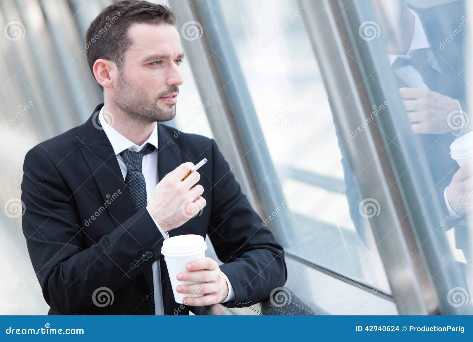 Portrait of an Attractive Businessman Having a Break Stock Photo ...