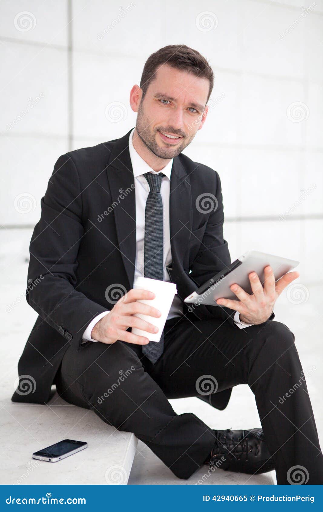 Portrait of an Attractive Businessman Using a Tablet Stock Image ...