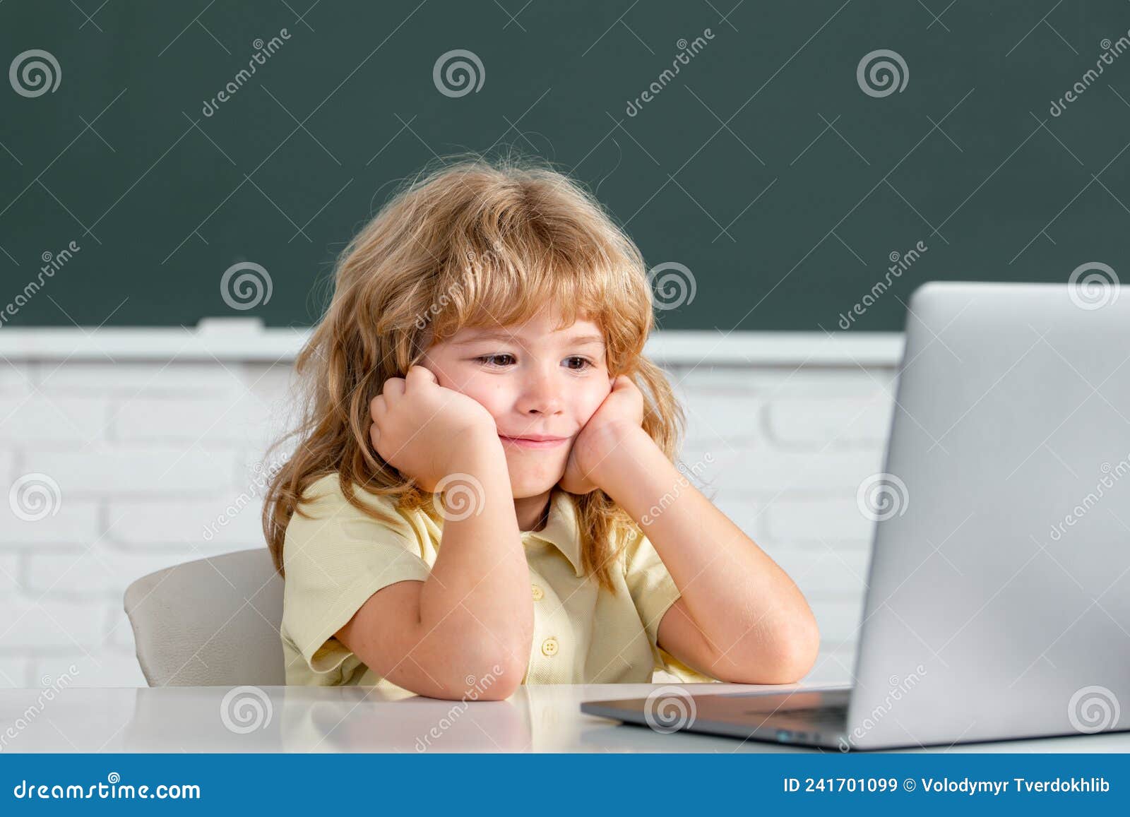 Portrait of Attractive Cheerful Boy Using Laptop. Online Learning ...