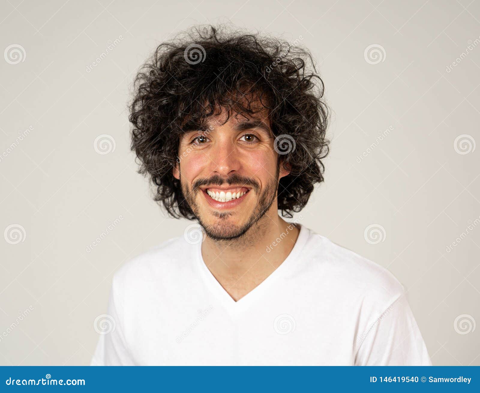 Portrait Of Attractive Cheerful Young Man With Smiling Happy Face
