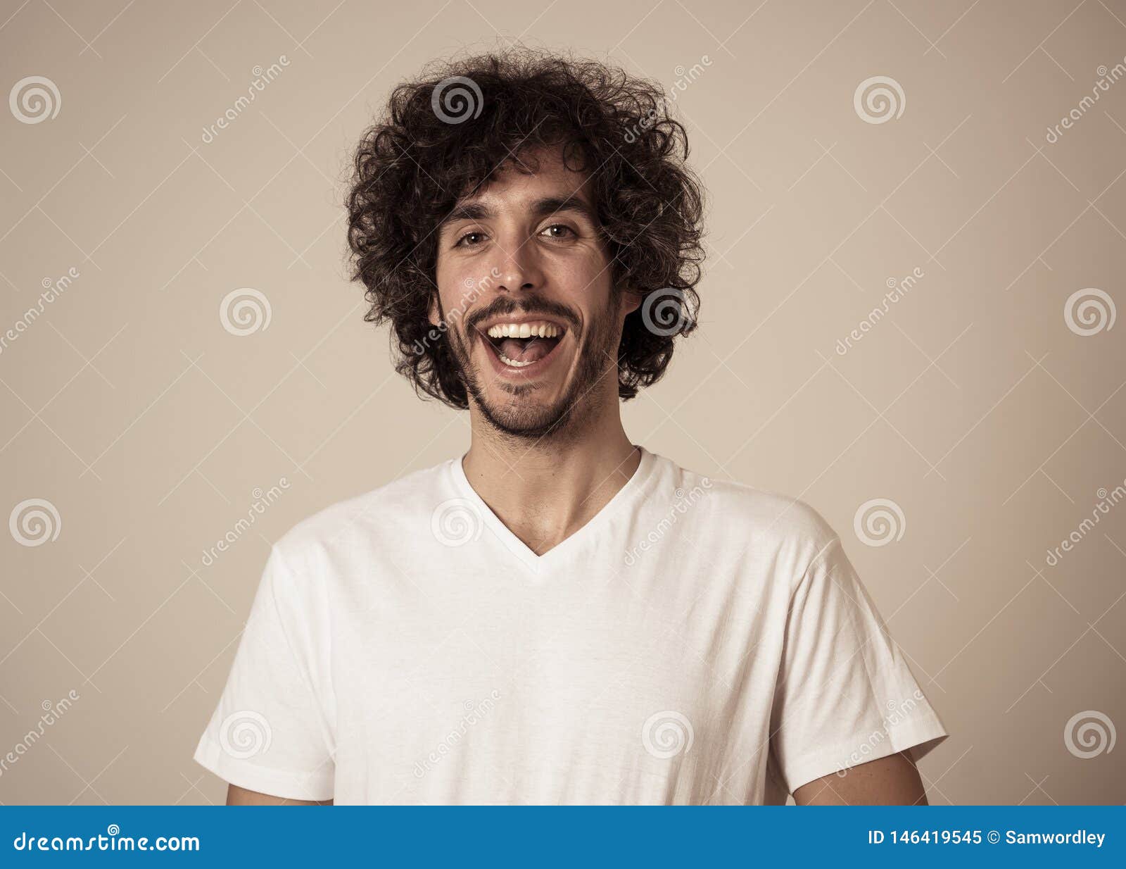 Portrait Of Attractive Cheerful Young Man With Smiling Happy Face