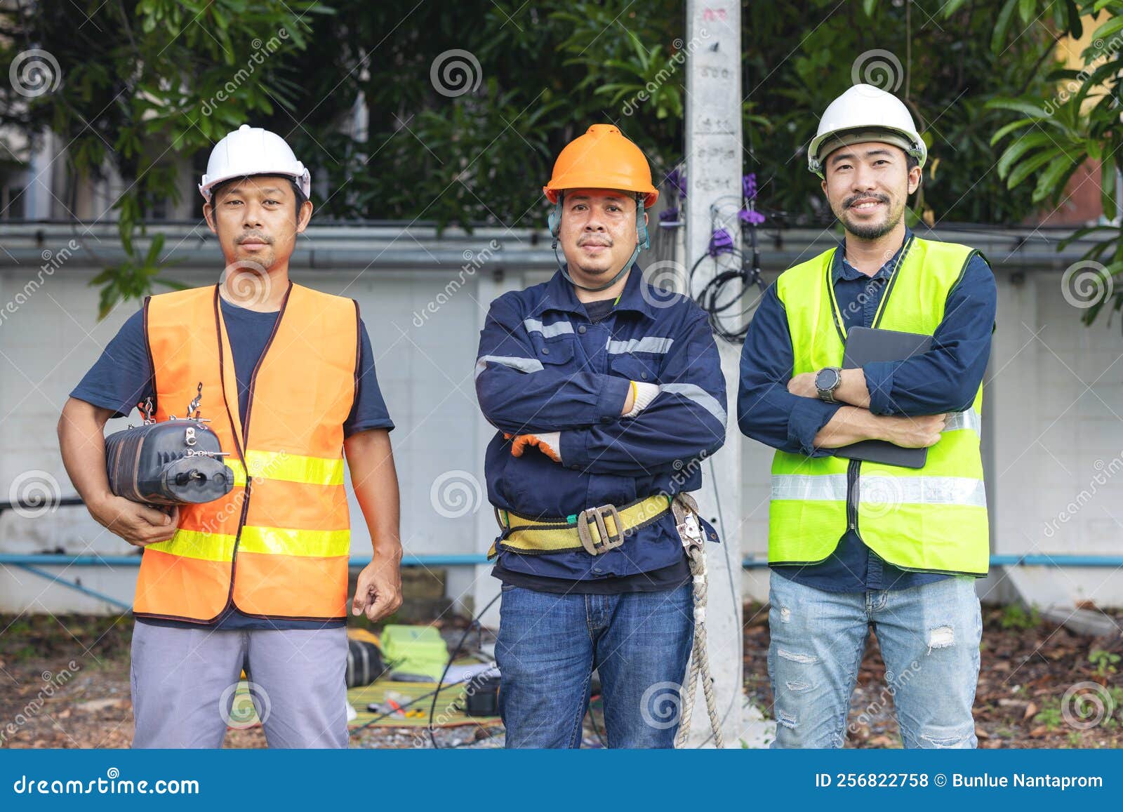 Portrait of an Attractive Electrician in Uniform on a Construction Site ...
