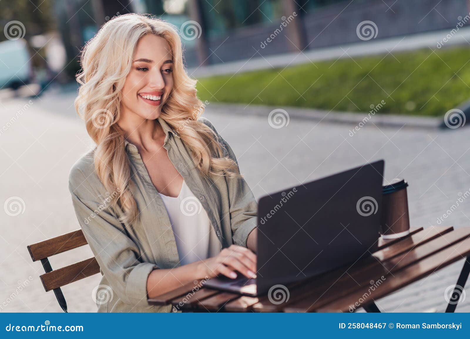 Portrait of Attractive Focused Cheerful Wavy Haired Girl Using Netbook ...