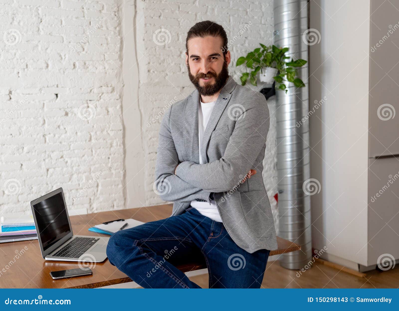 Portrait Of Attractive Happy Hipster Businessman In Modern Fashion Home