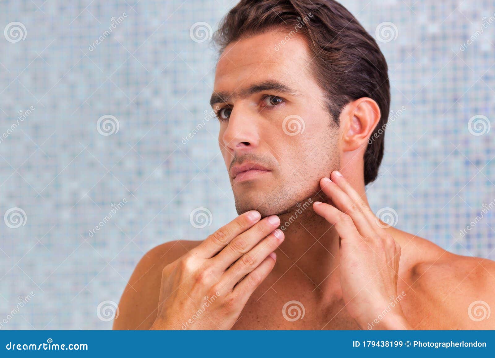 Portrait of Attractive Man Checking His Face in the Mirror Stock Image ...