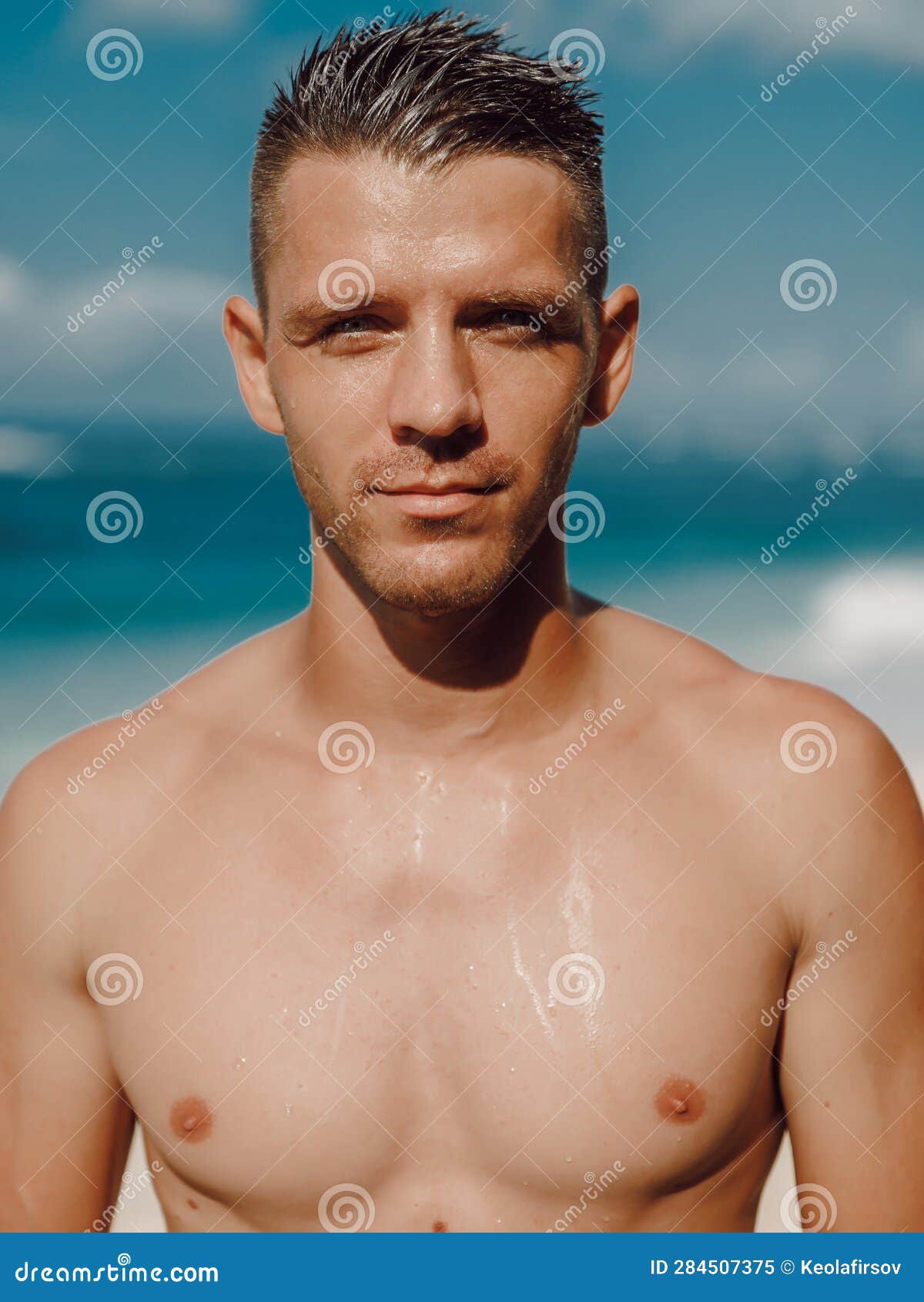 Portrait of Attractive Man on a Tropical Beach. Man Looking at Camera ...
