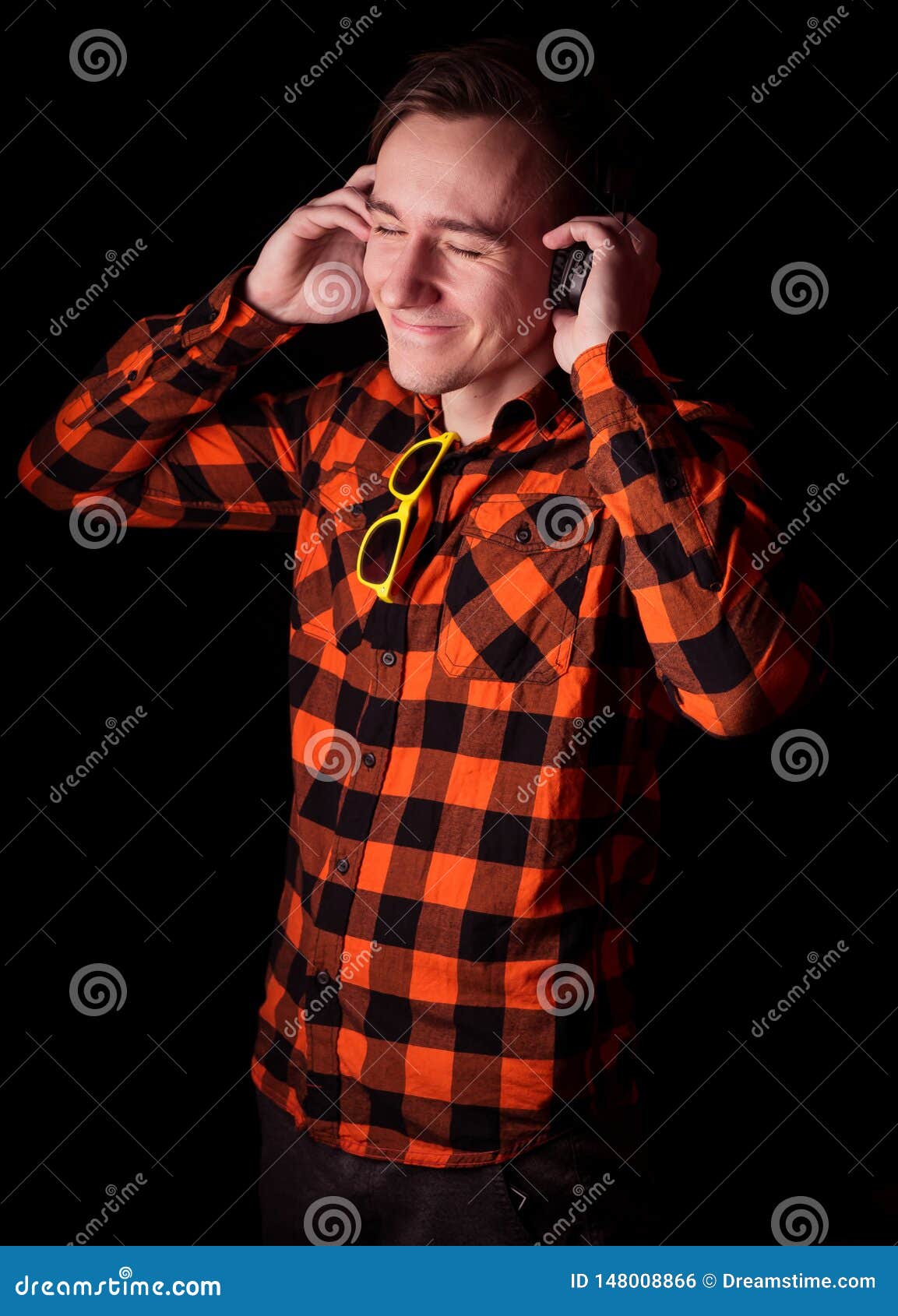 Young Handsome Man With Headphones And Modern Sunglasses In Stylish