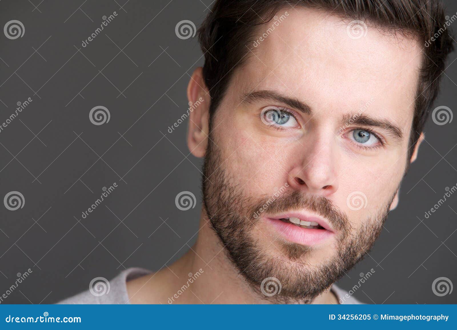 Portrait of an Attractive Young Man with Blue Eyes and Beard Stock ...