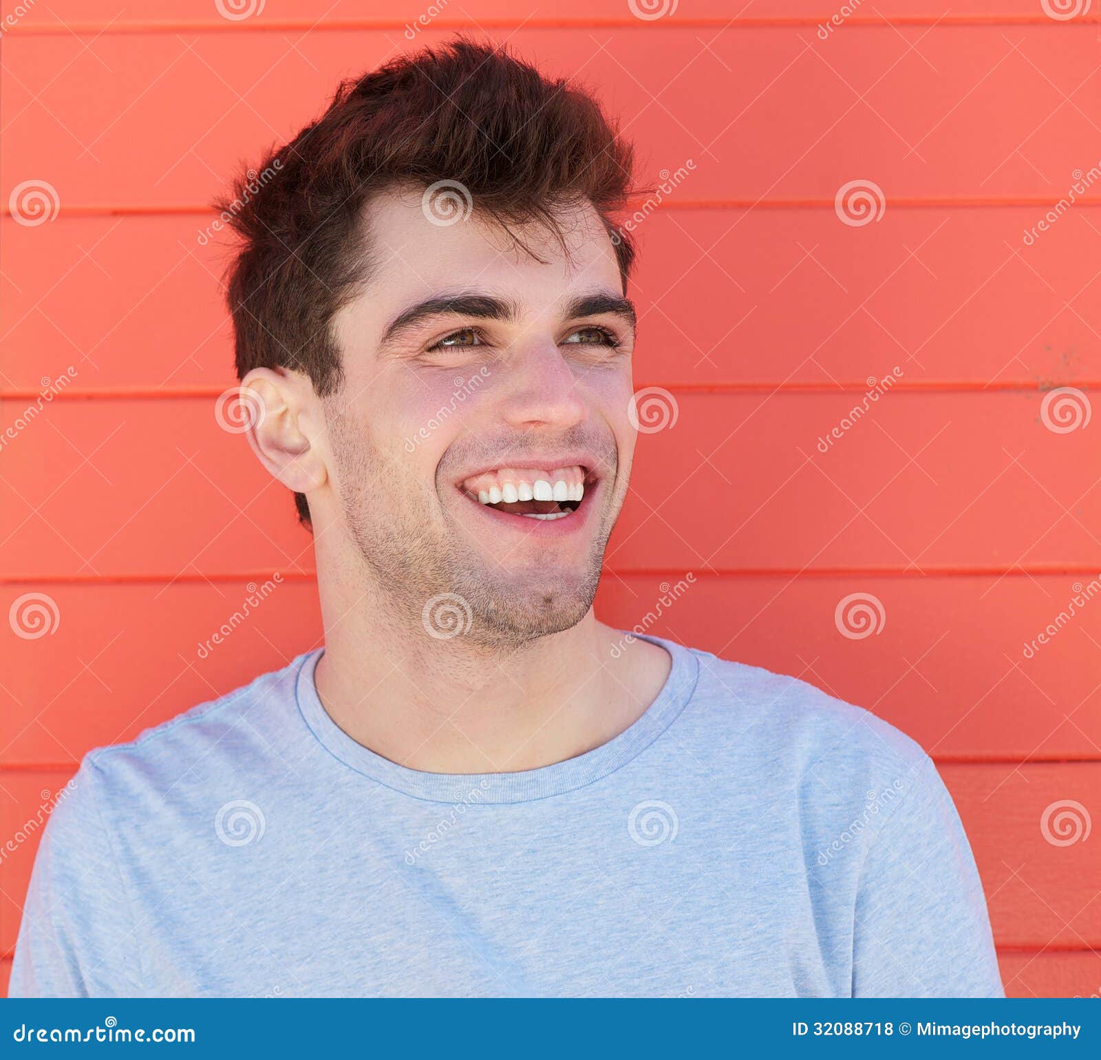 Portrait of an Attractive Young Man Laughing Outdoors Stock Photo ...